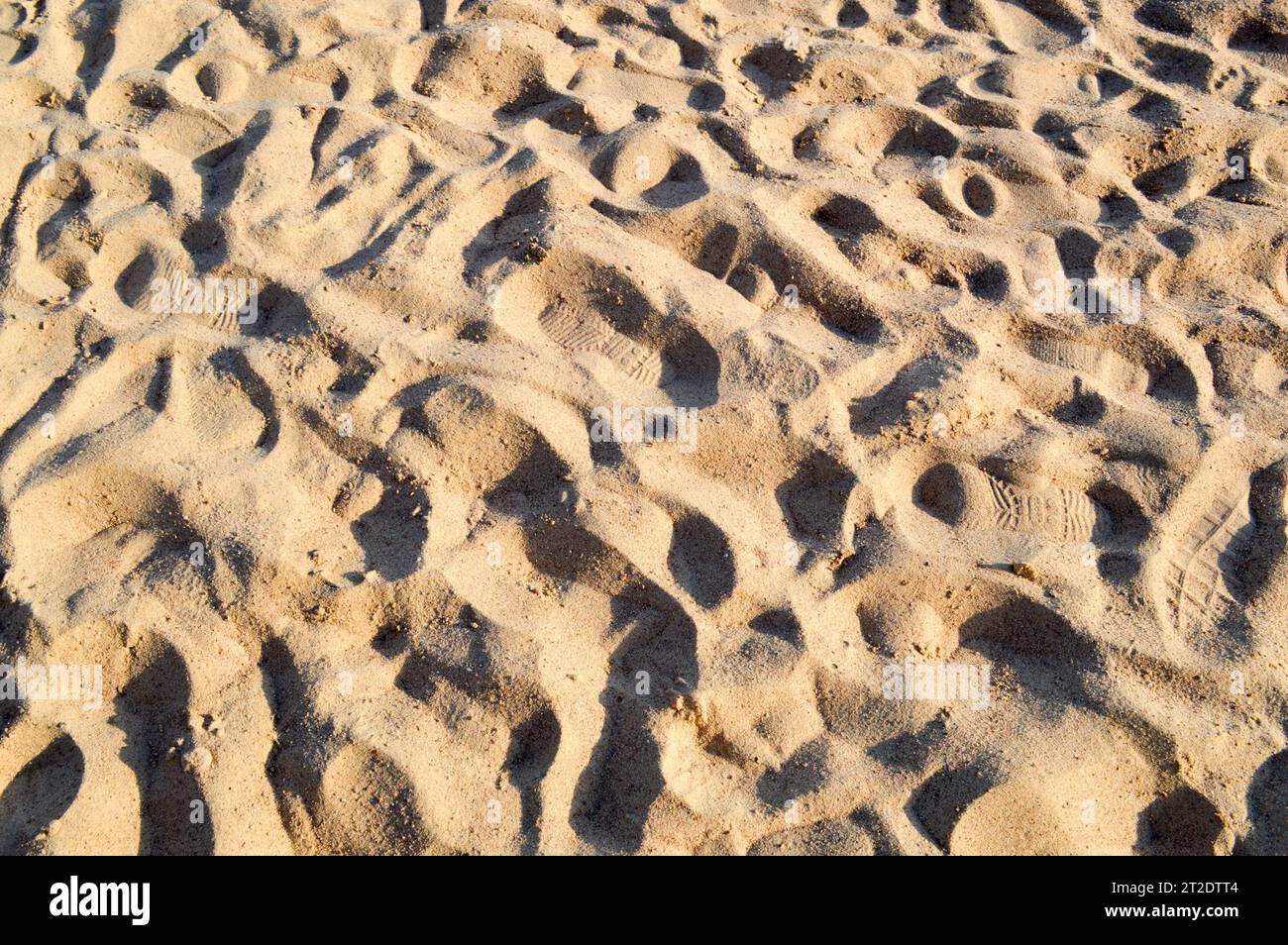 Beautiful yellow airy loose sea sand with waves. Texture. The ...