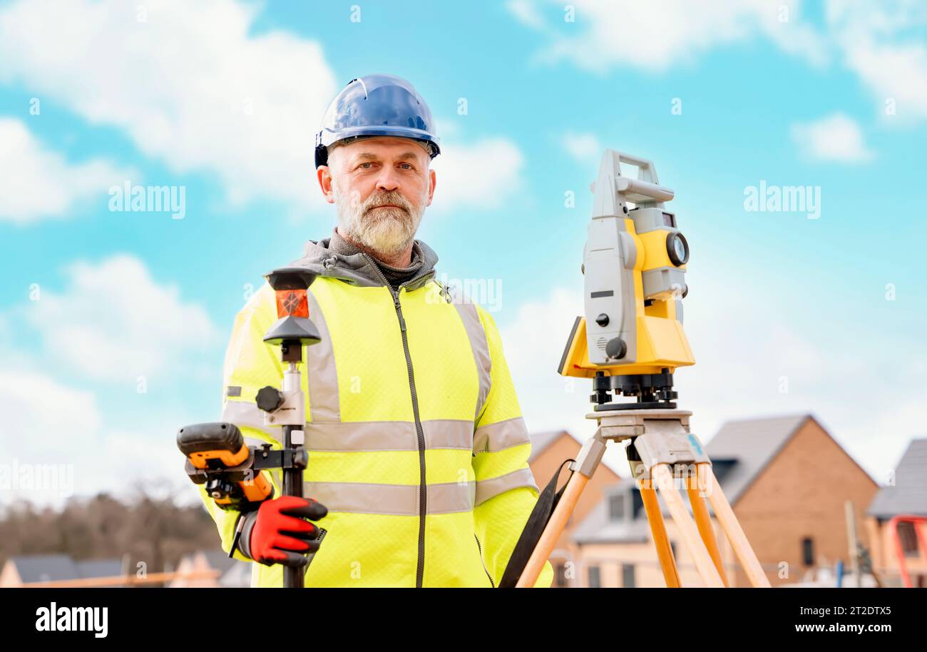 Surveyor builder site engineer with theodolite total station at ...