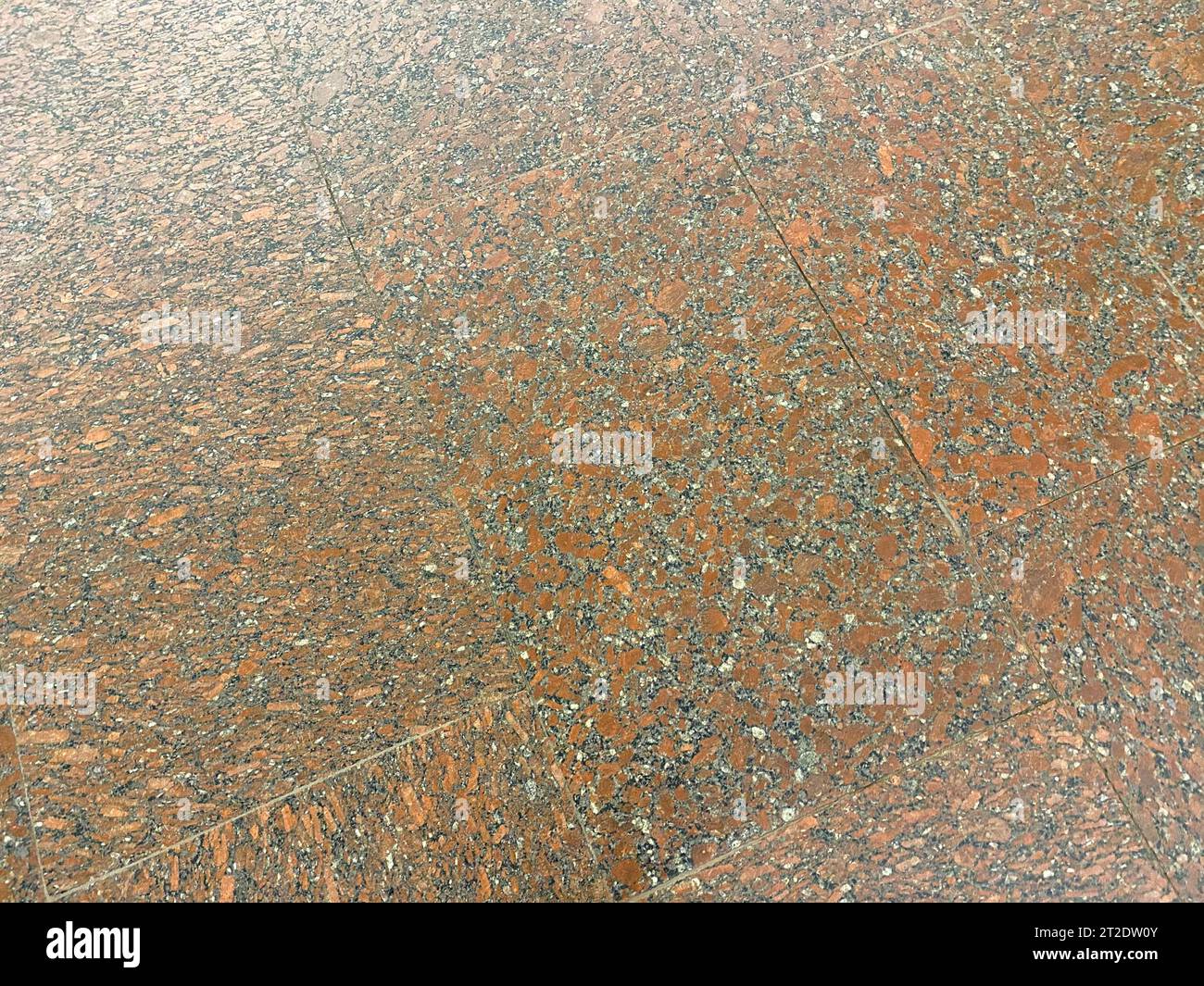 The texture of the stone granite floor of cold hard tiles. The ...