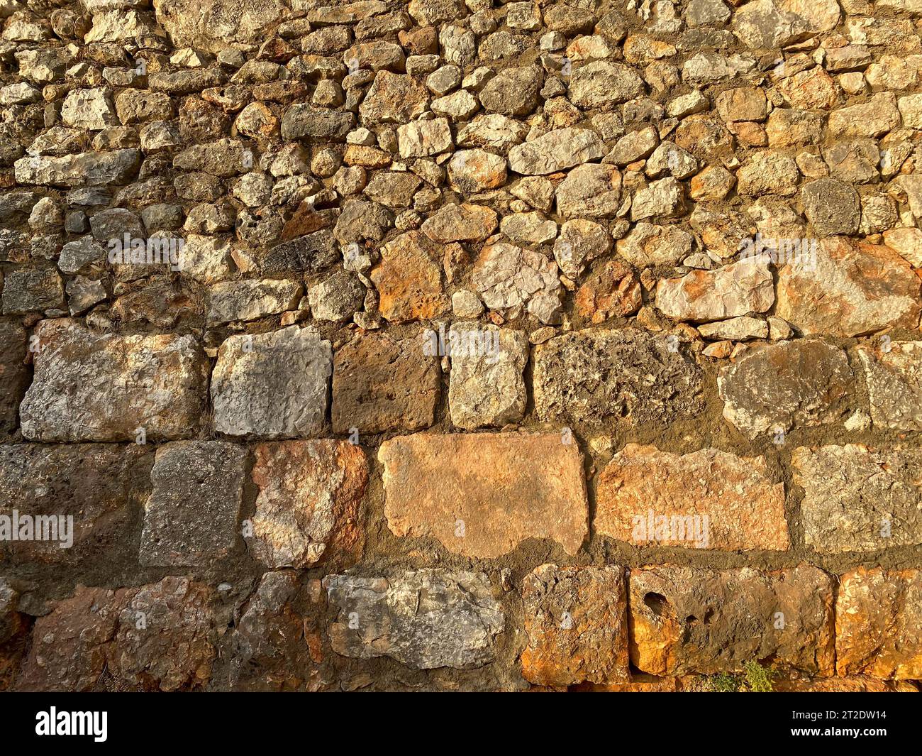Background, texture, stone wall of round stones cobblestones bricks ...