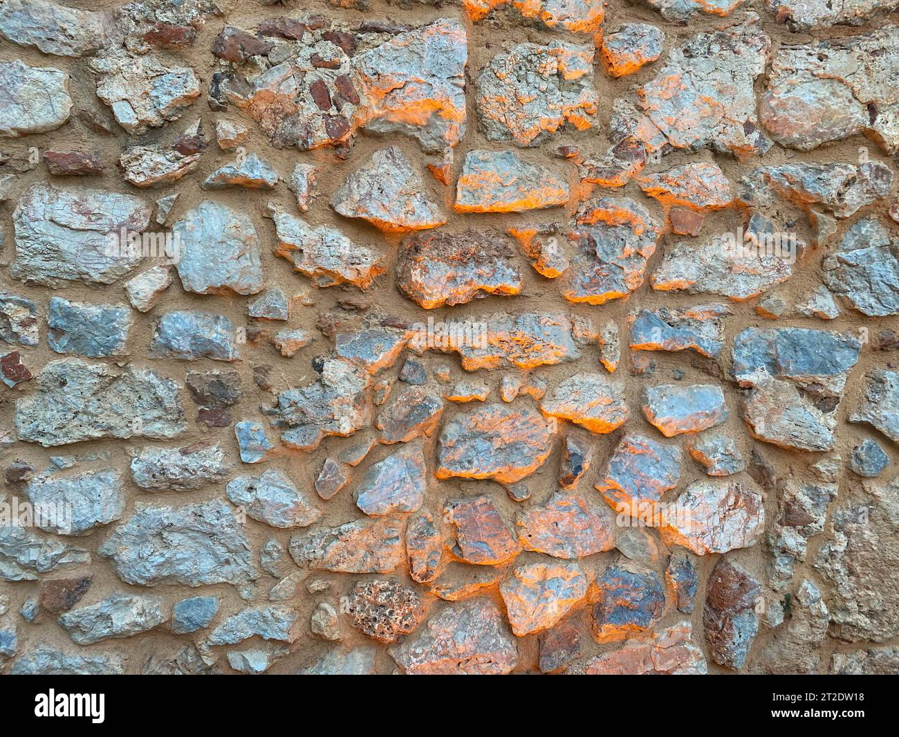 Background, texture, stone wall of round stones cobblestones bricks ...