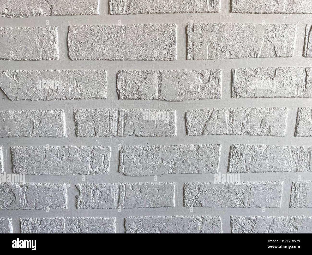 The surface texture of a homemade white loft-style brick wall with ...