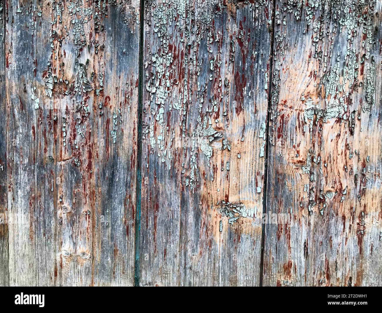 Texture of a black gray old wooden wall, a fence with pieces of old ...