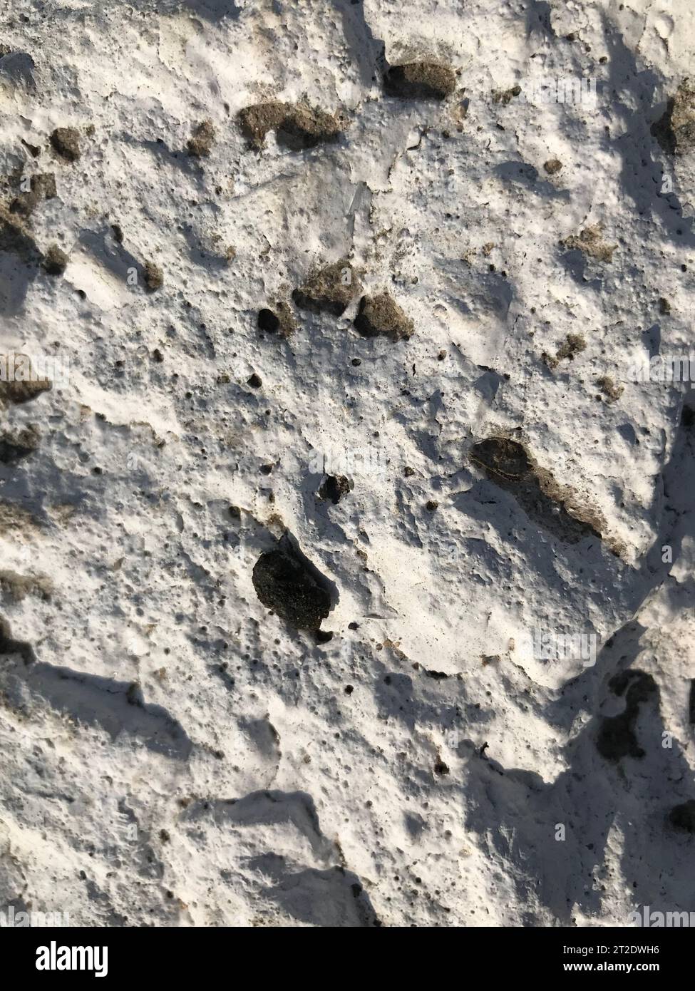 Texture of white stone lime painted with spots and cracks, background ...