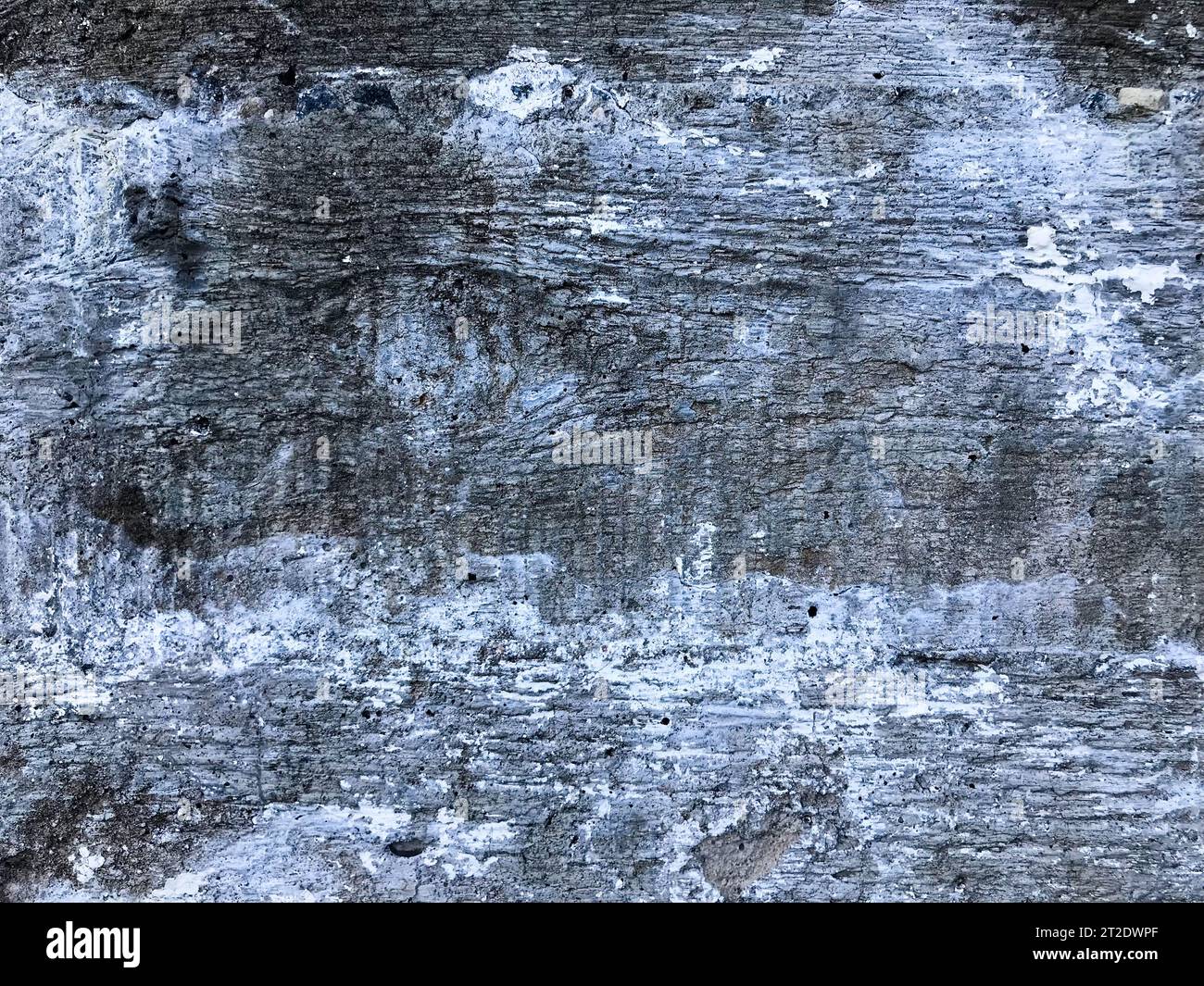 The texture of the old gray concrete cement plaster wall with cracks ...