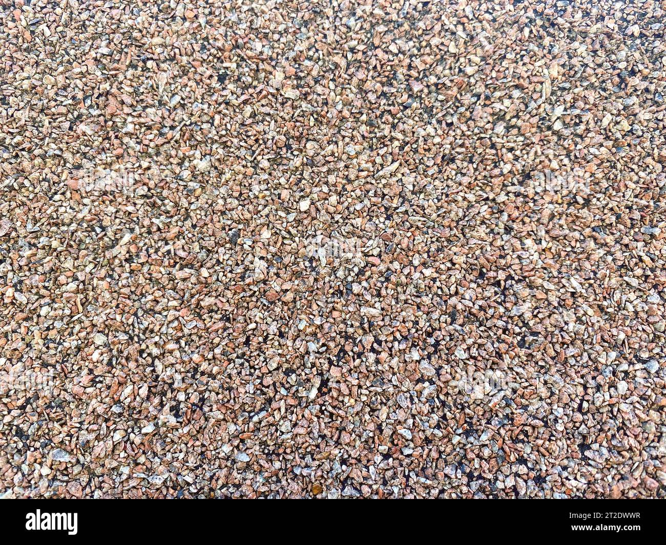 sports ground cover. rubber coating with small patches. pink rubber ...