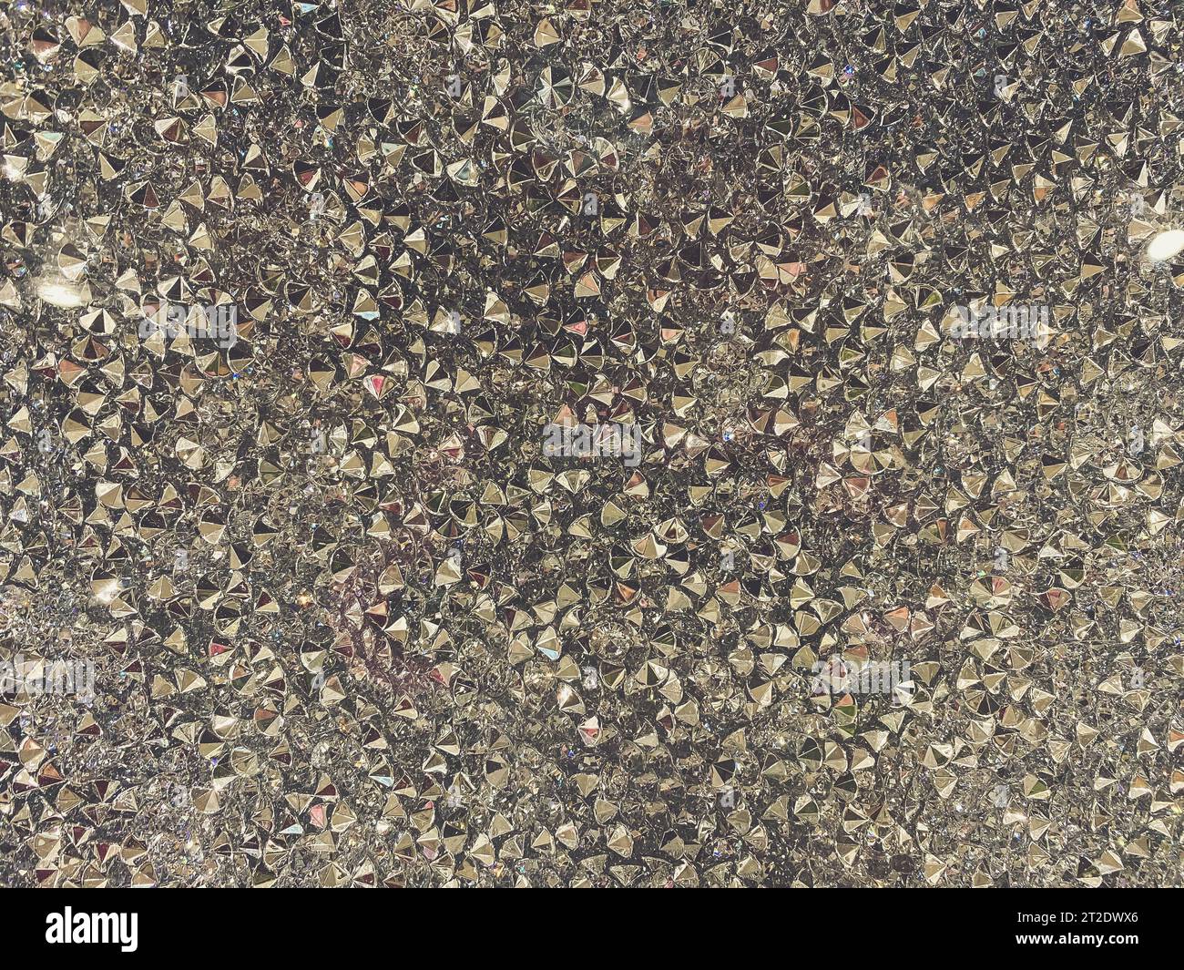 shiny texture, a piece of metal glitters in the sun. dark black metal ...