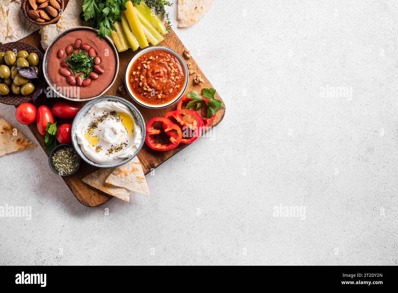 Arabic mezze platter - foul, labneh yogurt, muhammara dip with pita ...