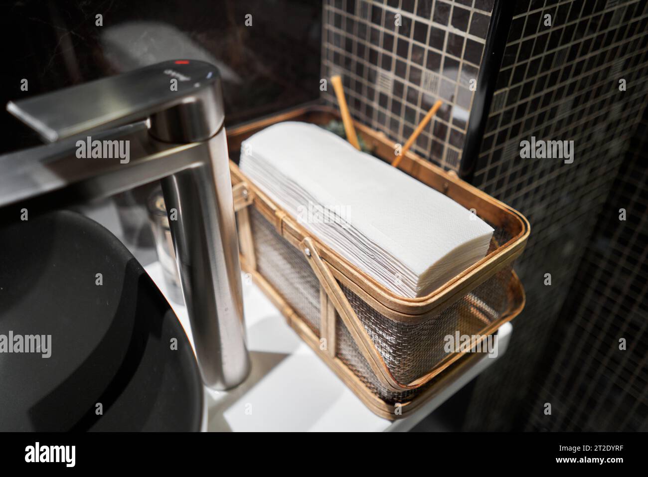 A stack of white folded towels or napkin in a toilet. Stack of white ...