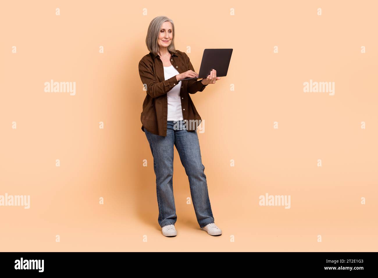 Full size body cadre of confident programmer old woman coding devops ... Full size body cadre of confident programmer old woman coding devops ...