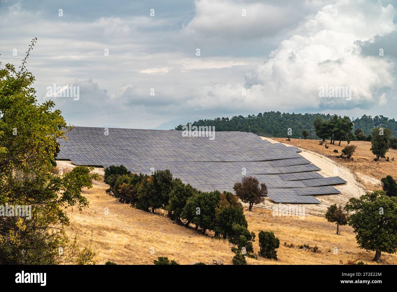 Field of photovoltaic solar panels built on the hillside Stock Photo ...