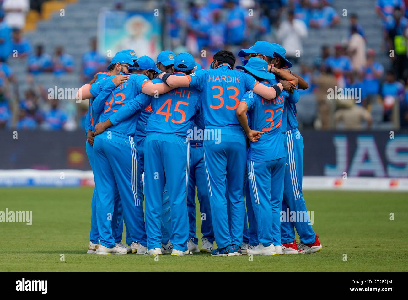 Indian team members gather in a circle before the start of their ...