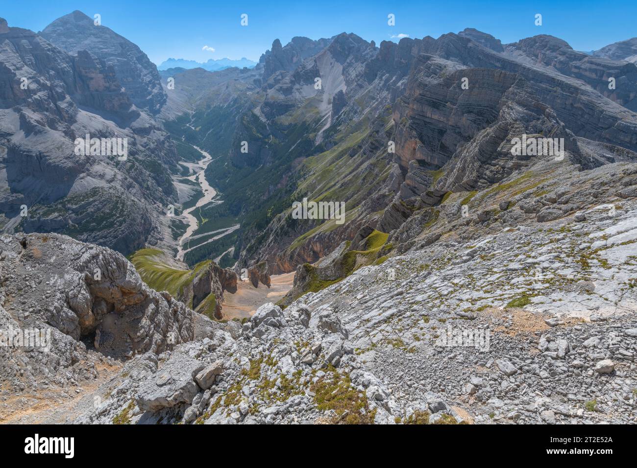 Aerial viewpoint down to deep alpine gorge, narrow valley between two ...
