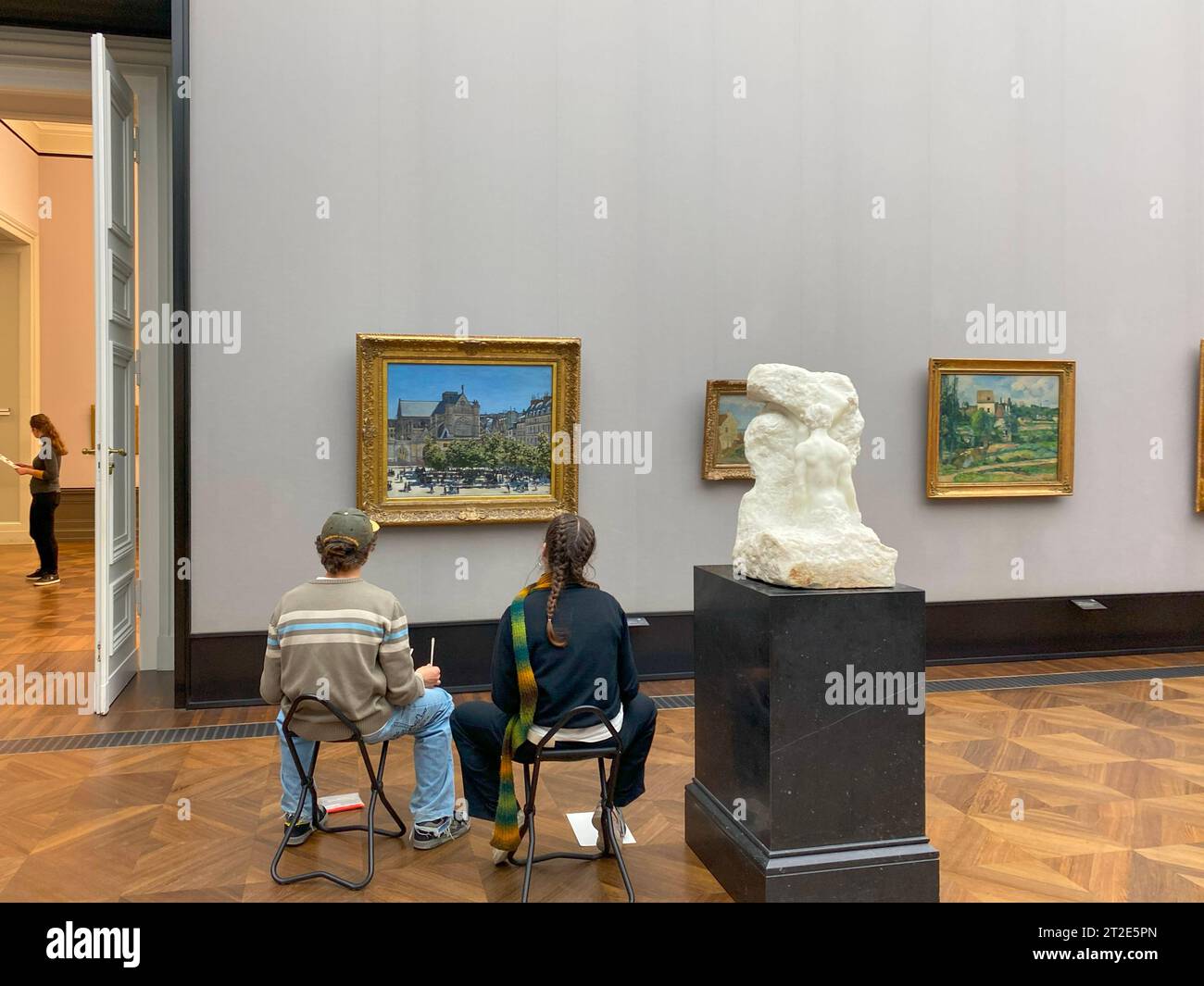 Art students studying paintings at Alte Nationalgalerie Berlin, Germany ...