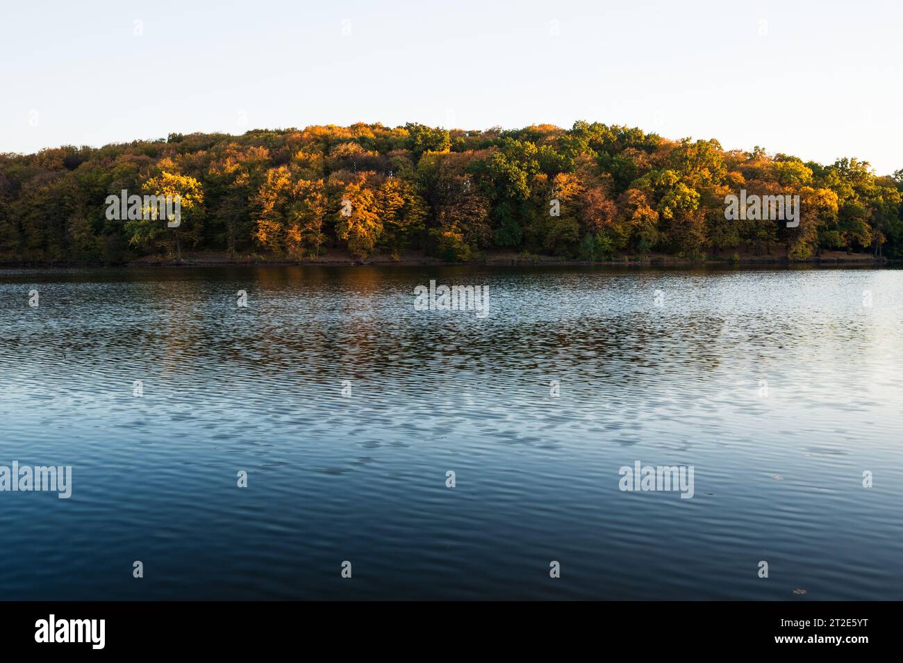 Beautiful scenic panoramic autumn view on bank of lake with trees ...