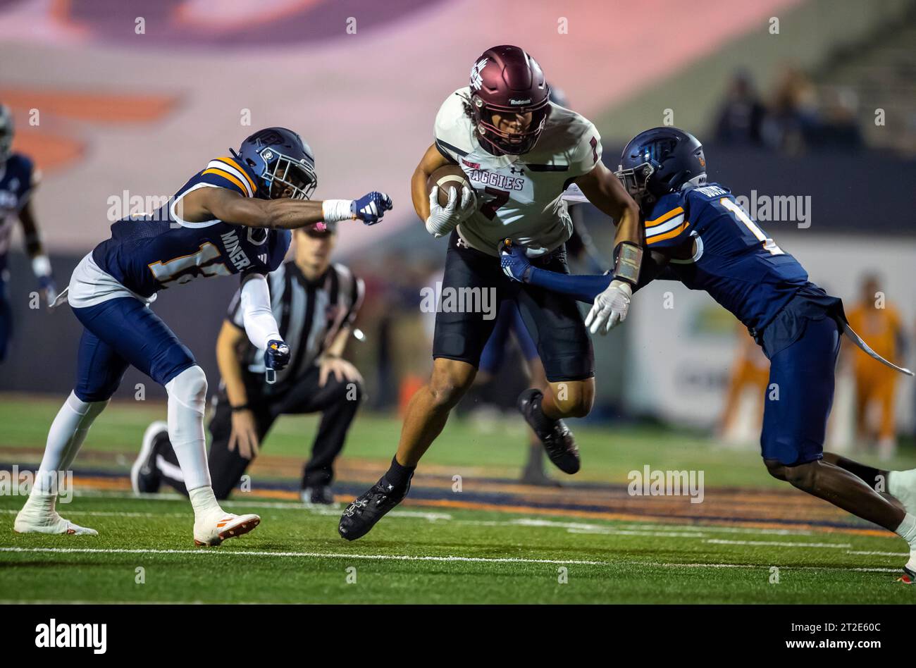 New Mexico State quarterback Eli Stowers (7) tries to avoid the tackle ...