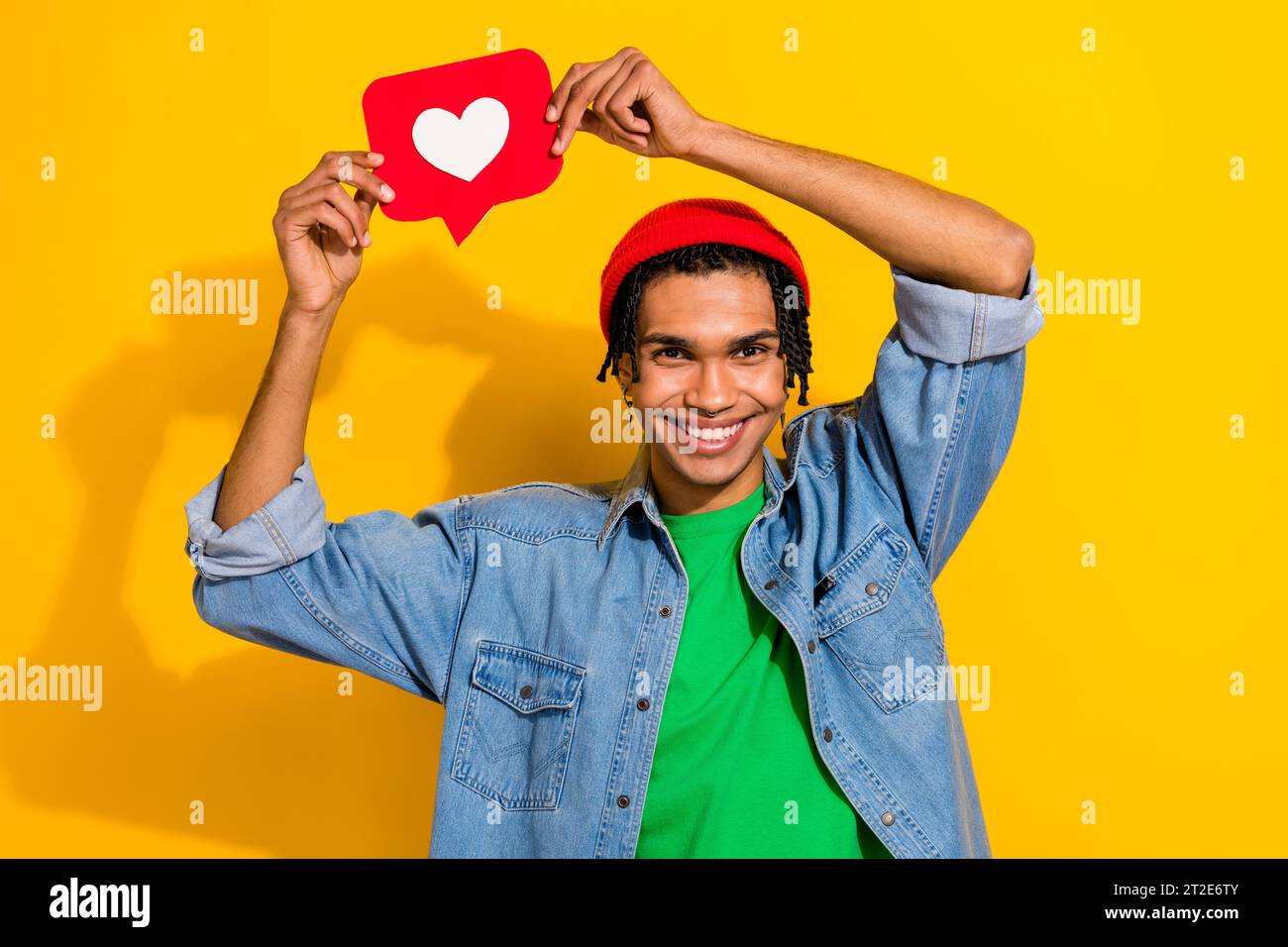 Photo of excited funky man wear jeans shirt red hat rising positive ...