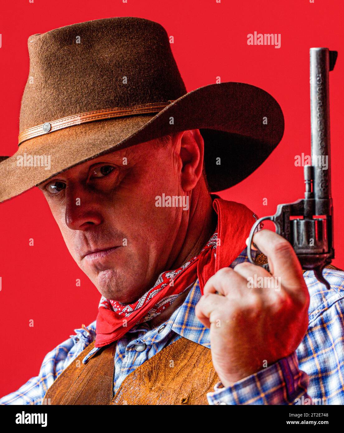 Man wearing cowboy hat, gun. West, guns. Portrait of a cowboy. American ...