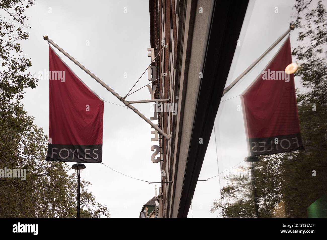 The Foyles flag reflected in a pane of glass outside Foyles bookshop on ...