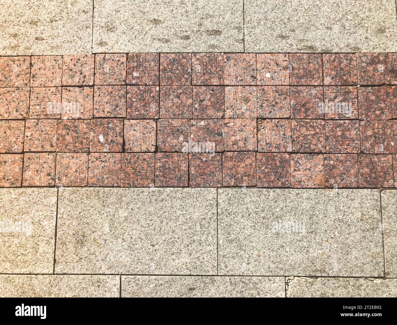 The brown texture of stone granite marble paving slabs. The background ...