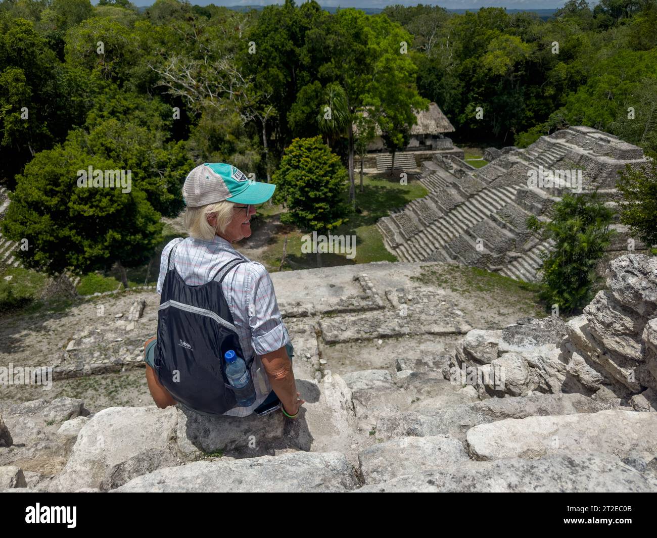 Tourist atop Structure 142, a temple pyramid in the North Acropolis in ...