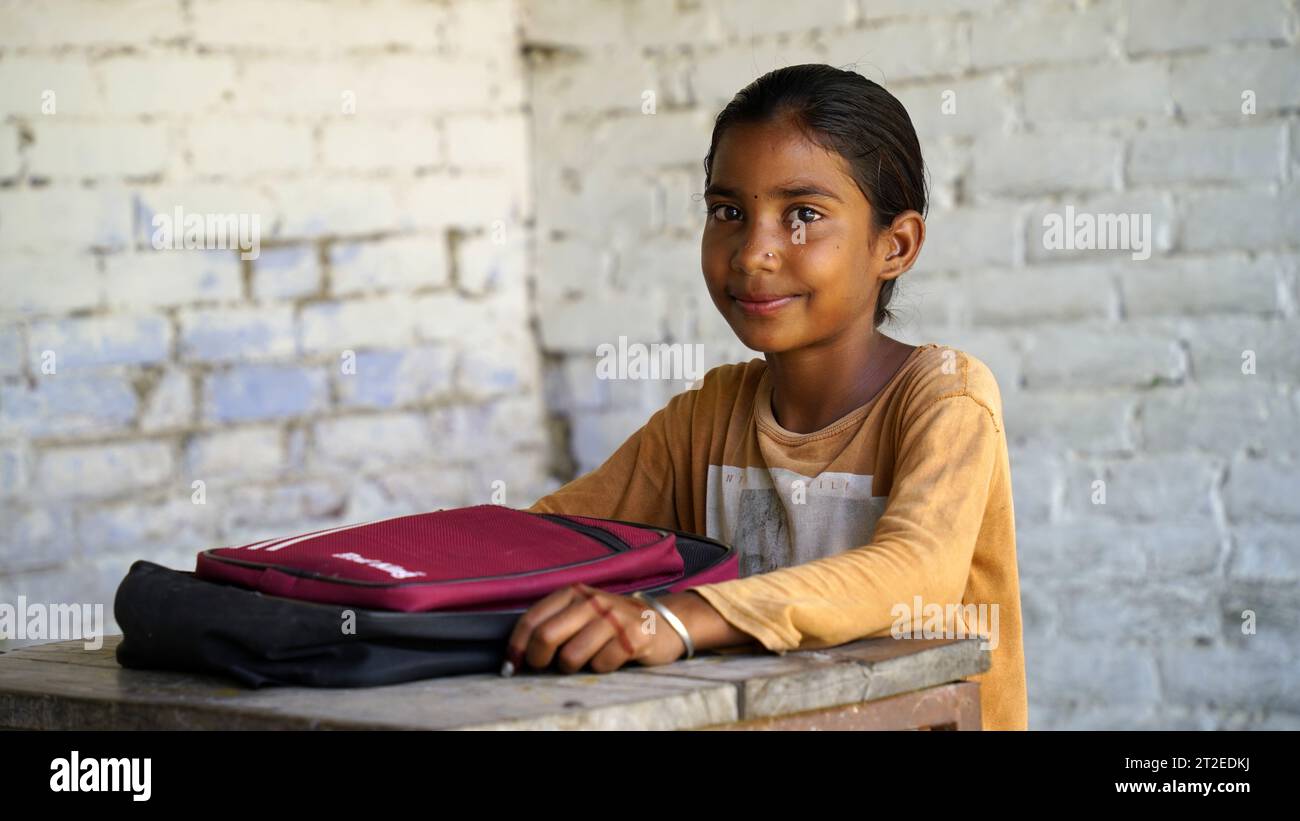 Happy Indian elementary school girls students sitting at desk in ...