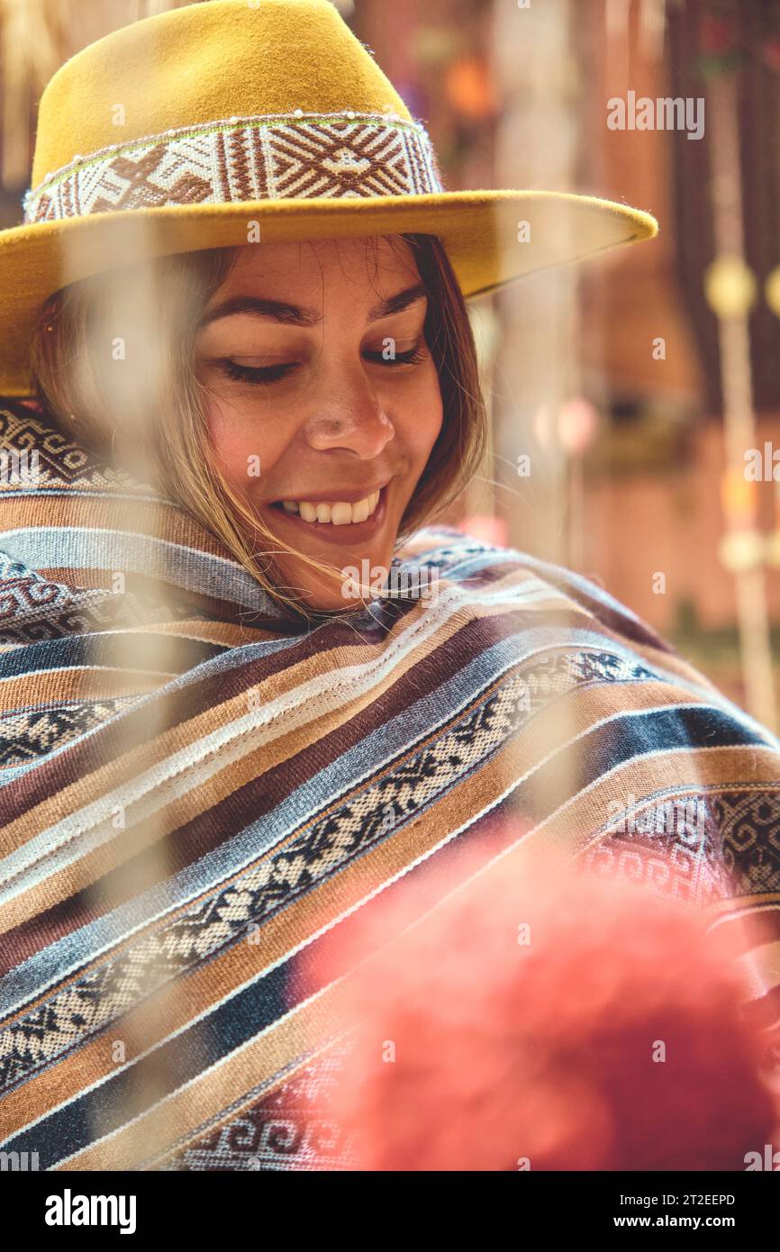Woman with hat. Hipster girl with andean look wearing poncho, young ... Woman with hat. Hipster girl with andean look wearing poncho, young ...