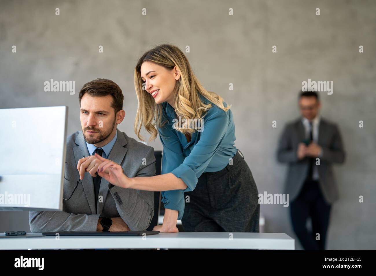 Business men with colleague traders at office monitoring stocks data on ...