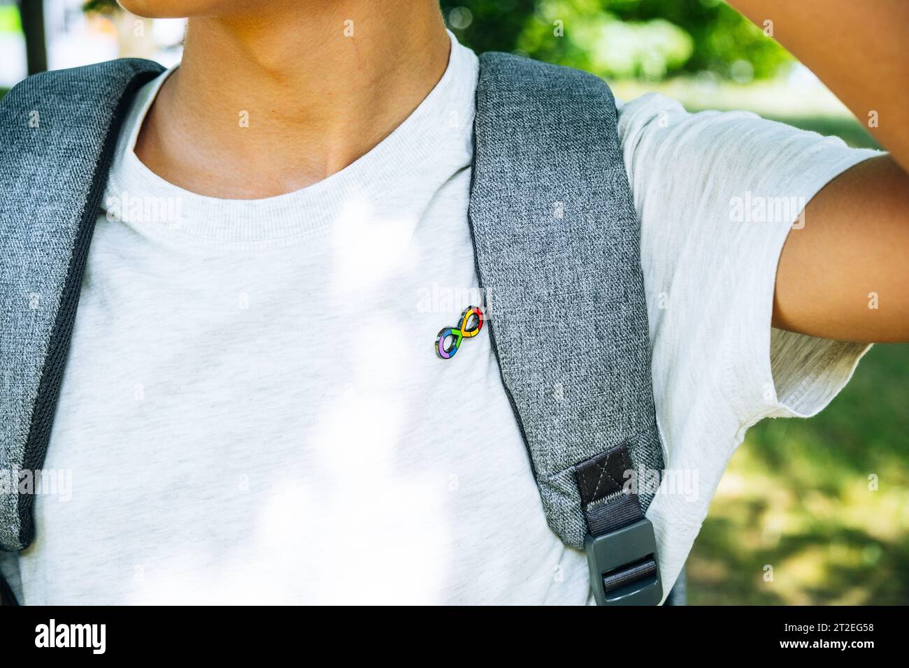 Kid with backpack with autism infinity rainbow symbol sign. World ...