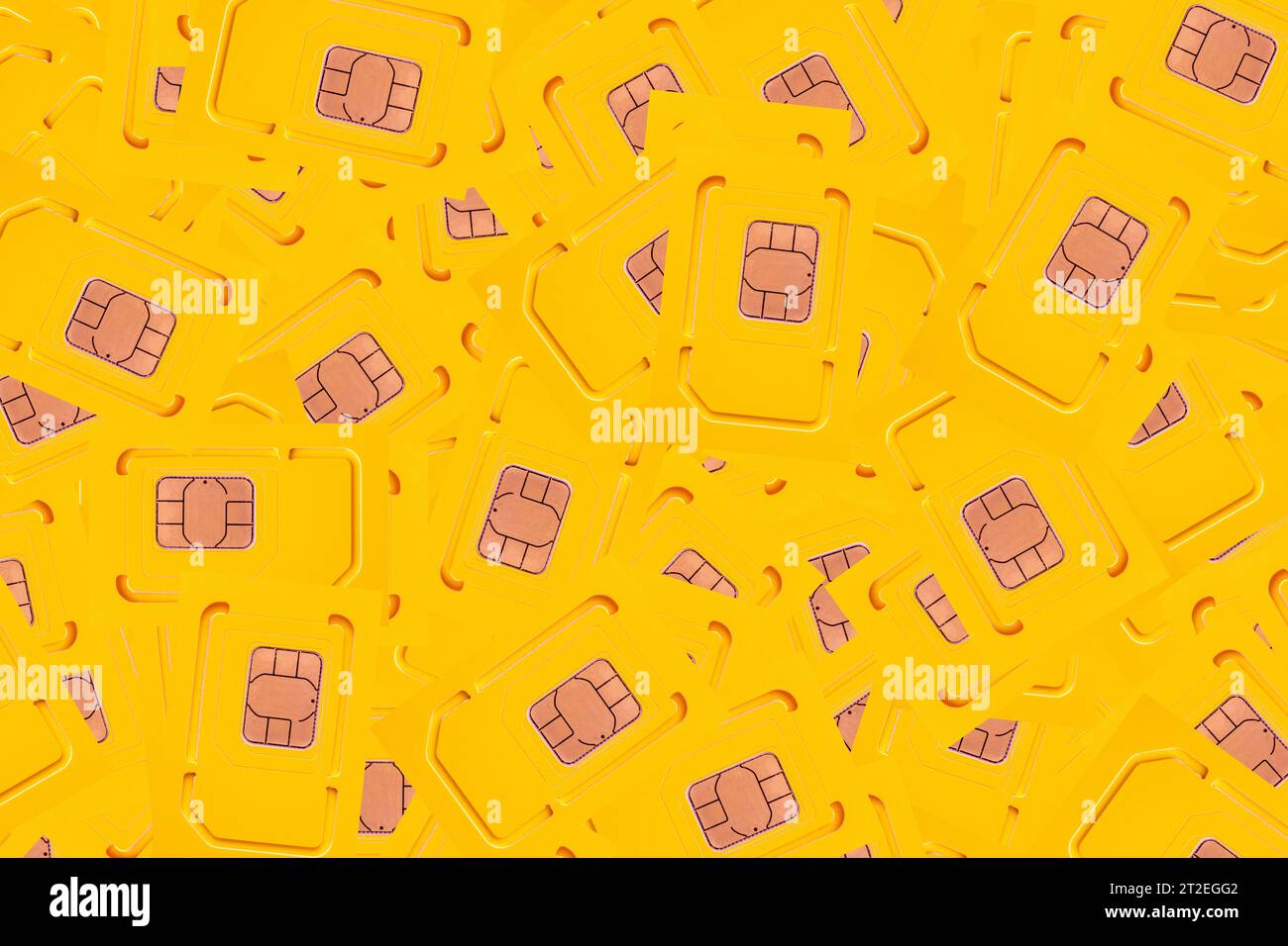a bunch of yellow SIM cards for phones close-up top view Stock Photo ...