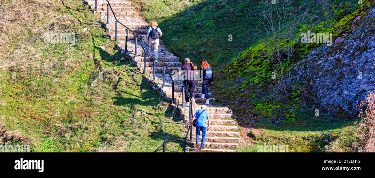 Group of active seniors hiking and climbing,the steps leading to ...