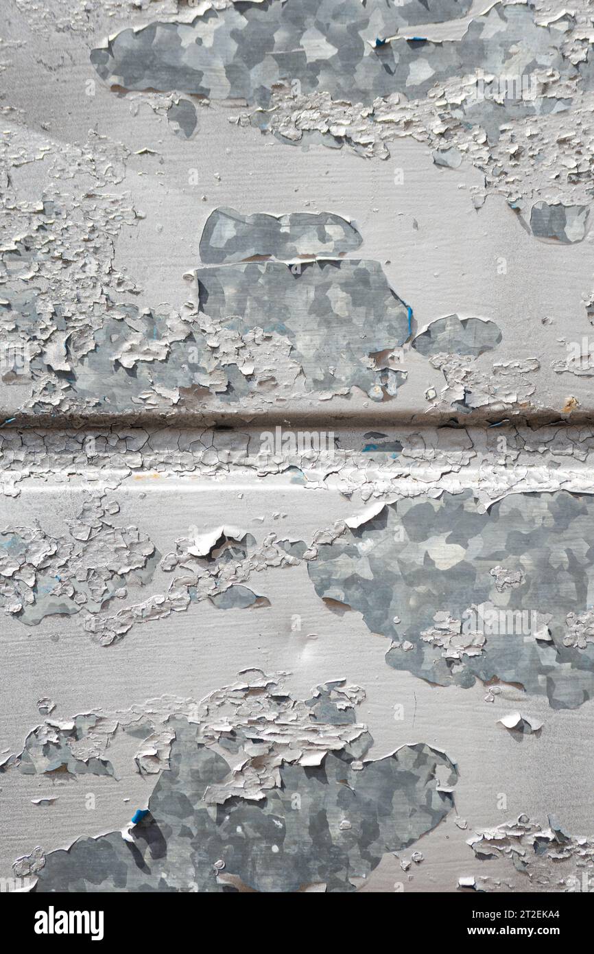 Rusty metal texture background. Unusual cracked spots of gray paint on ...