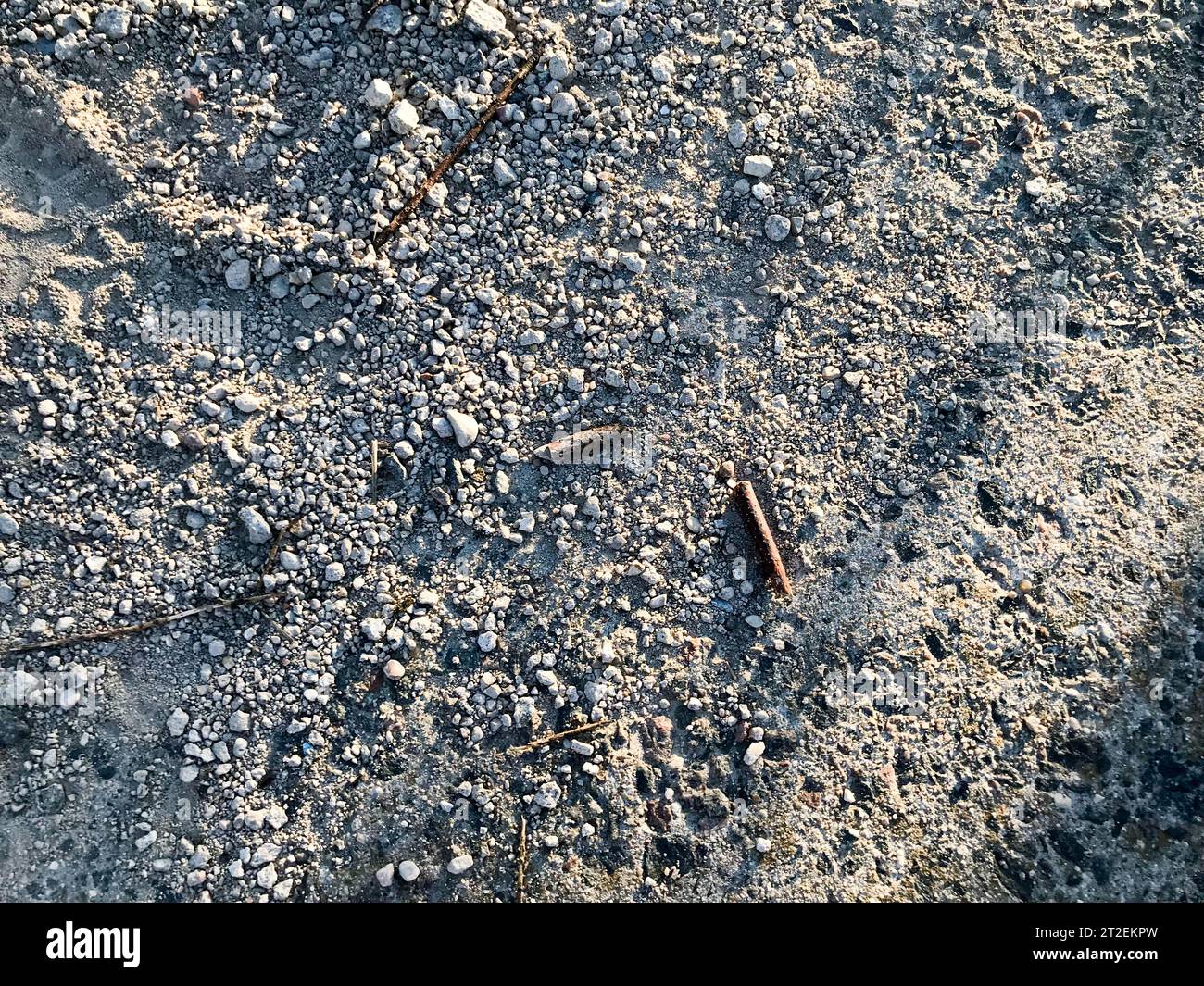The texture of a gray stone broken, crumbling cement stone floor, walls ...