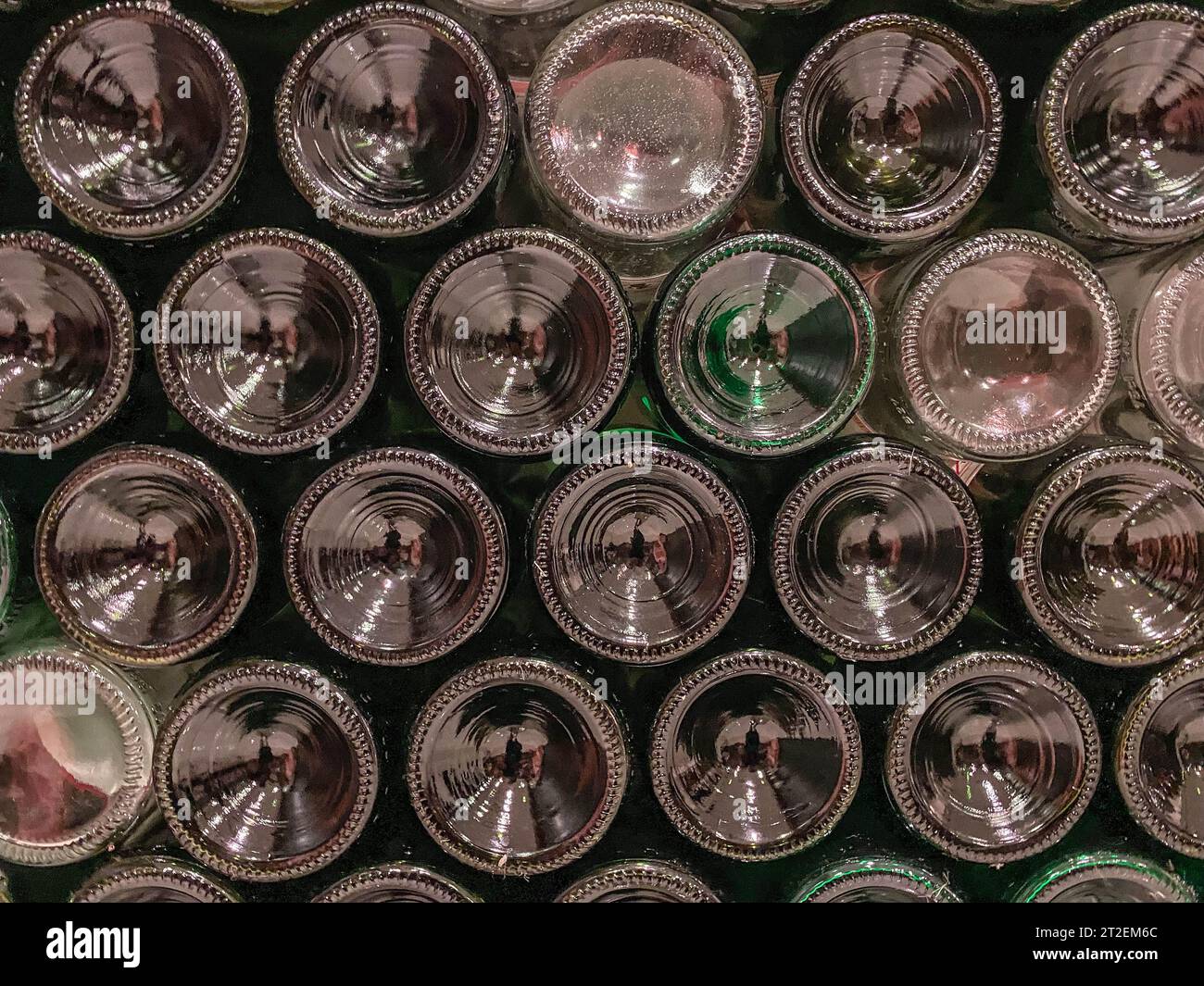 glass bottles, texture. window display in a bar. small glass bottoms ...