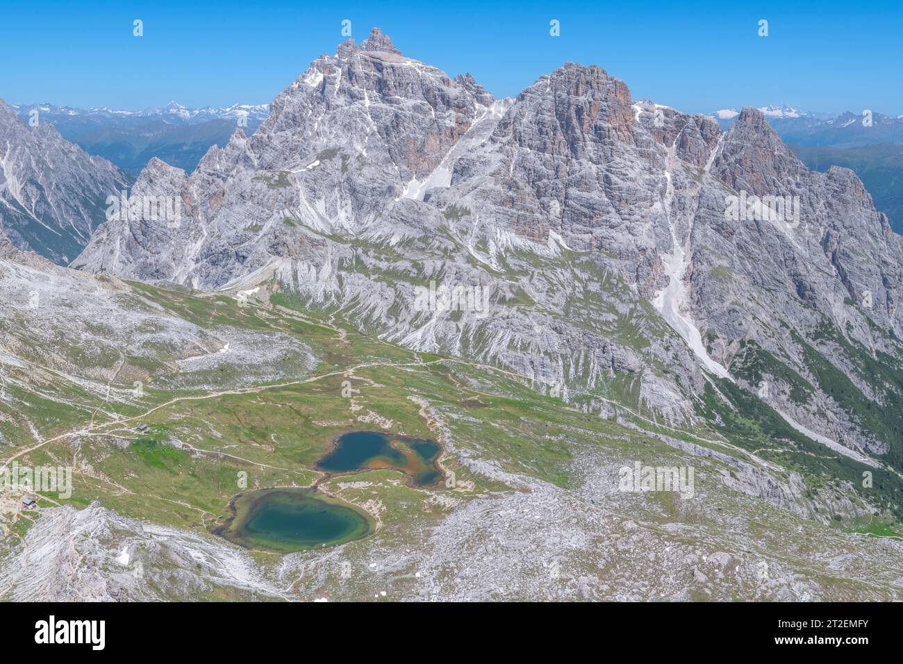 Tre Scarperi mountain towering above a group of small alpine lakes near ...