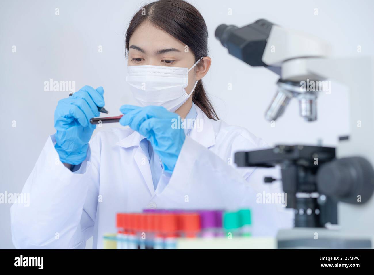 Female doctor write a blood sample Stock Photo - Alamy