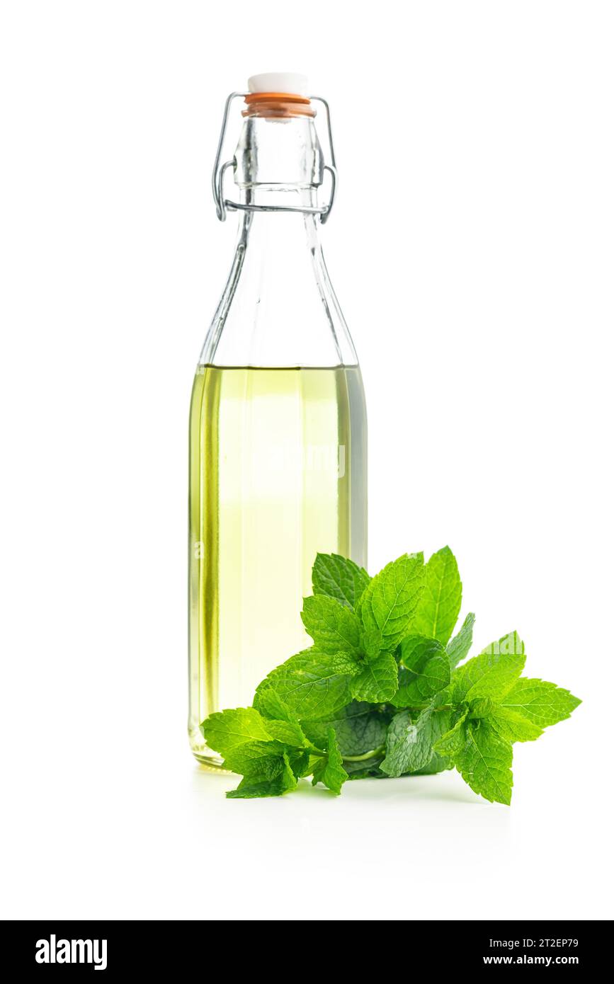 Sweet mint syrup and mint leaves isolated on the white background Stock ...