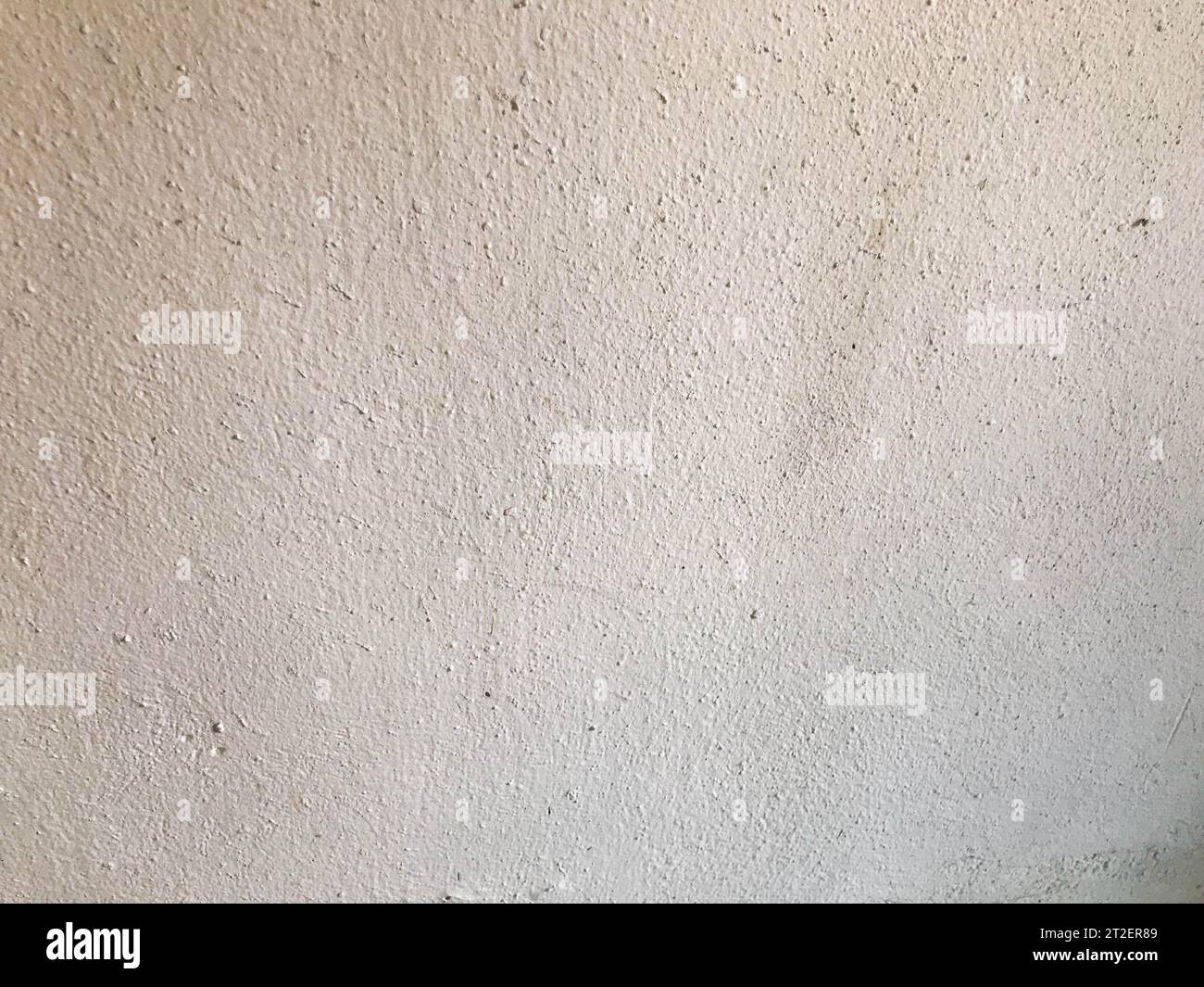 The texture of the stone concrete old shabby wall with cracks and chips ...