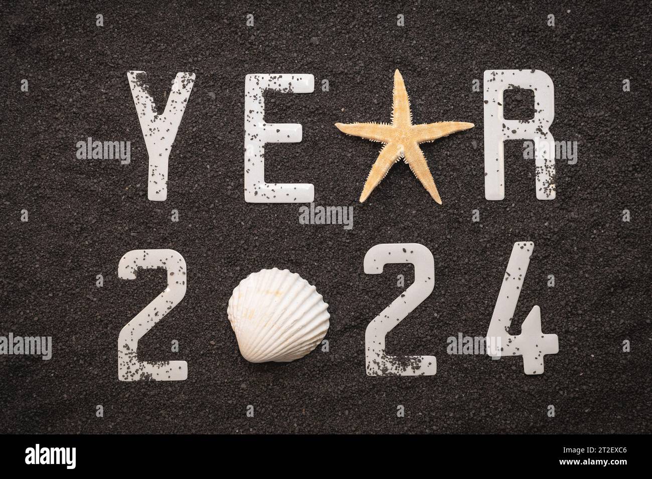 Happy New Year 2024: New Year 2024 concept on the black sand of a beach ...