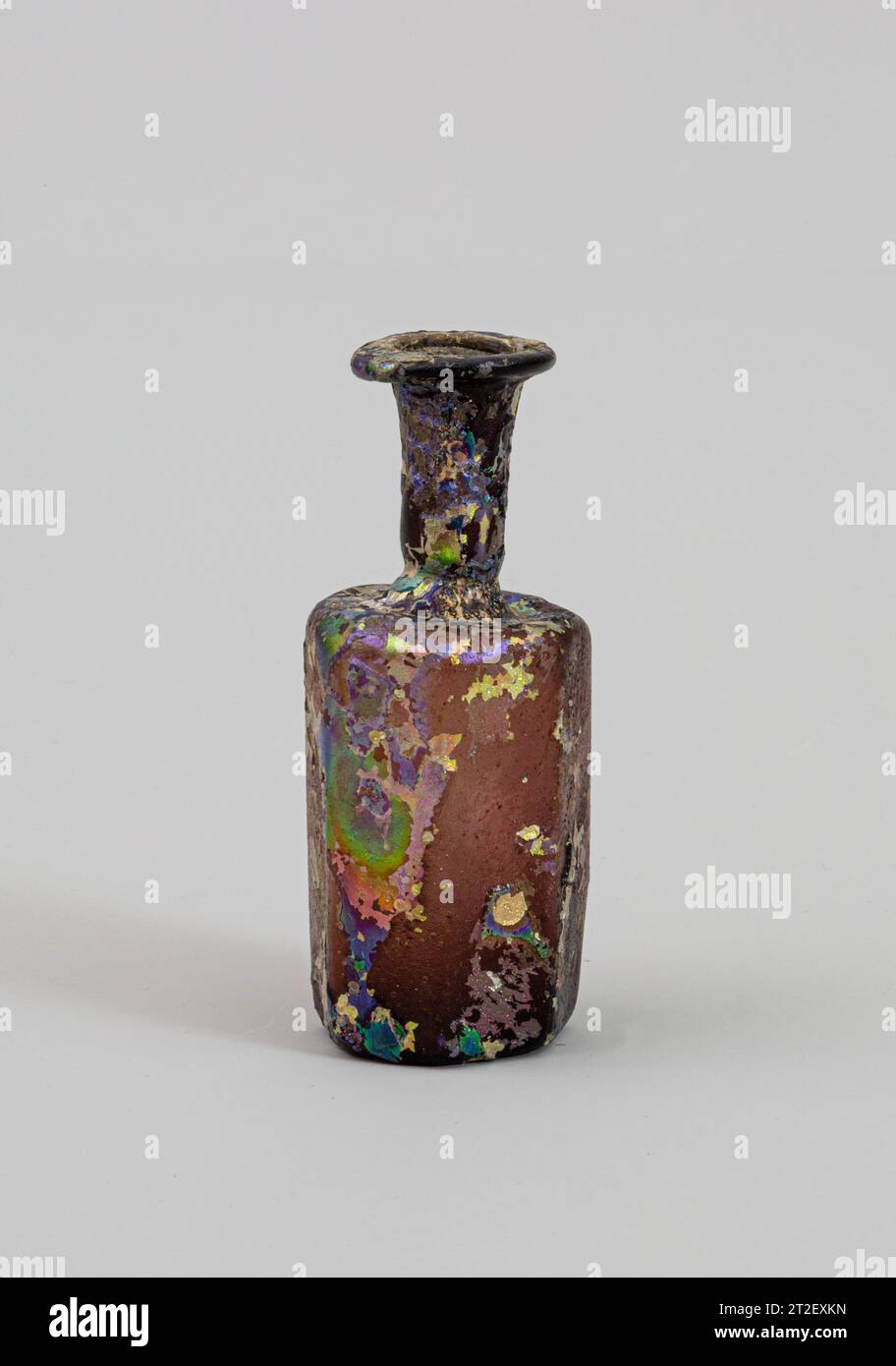 Glass heptagonal bottle Roman ca. 3rd–4th century CE Translucent purple.Rim folded out, round ...