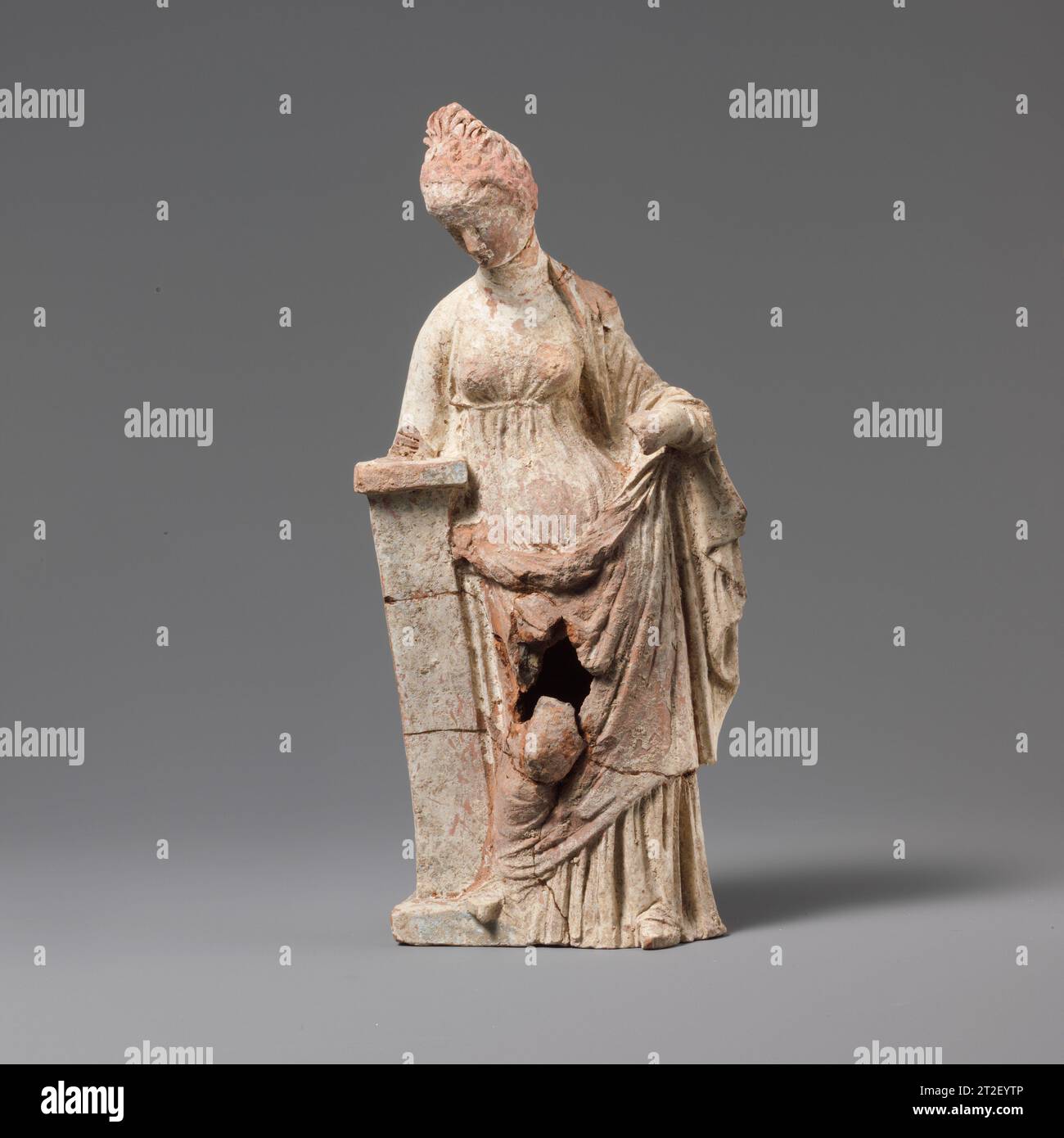 Terracotta statuette of a woman leaning on a pillar Greek, South ...