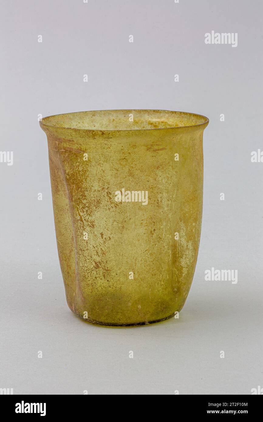 Glass indented beaker Roman mid–1st to 3rd century CE Translucent light ...