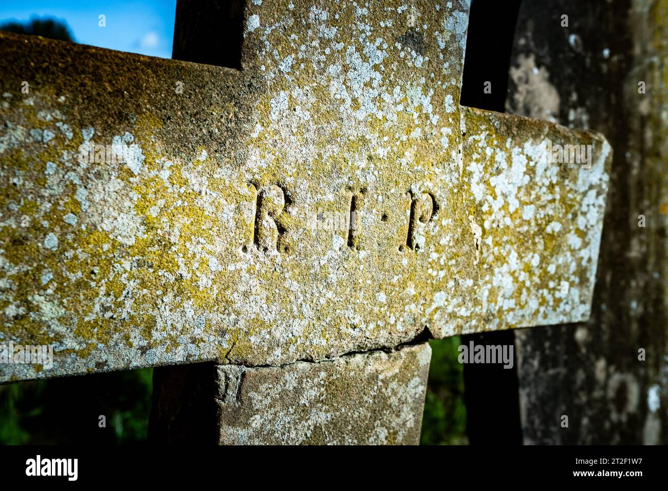 R.I.P Rest In Peace on a cross headstone in English church graveyard ...