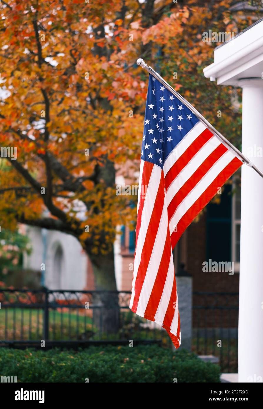 American flag on house fall leaves hi-res stock photography and images ...