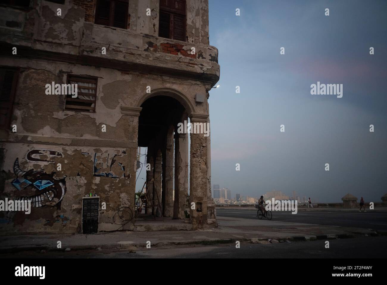 A building in poor condition stands across the street from the malecon ...