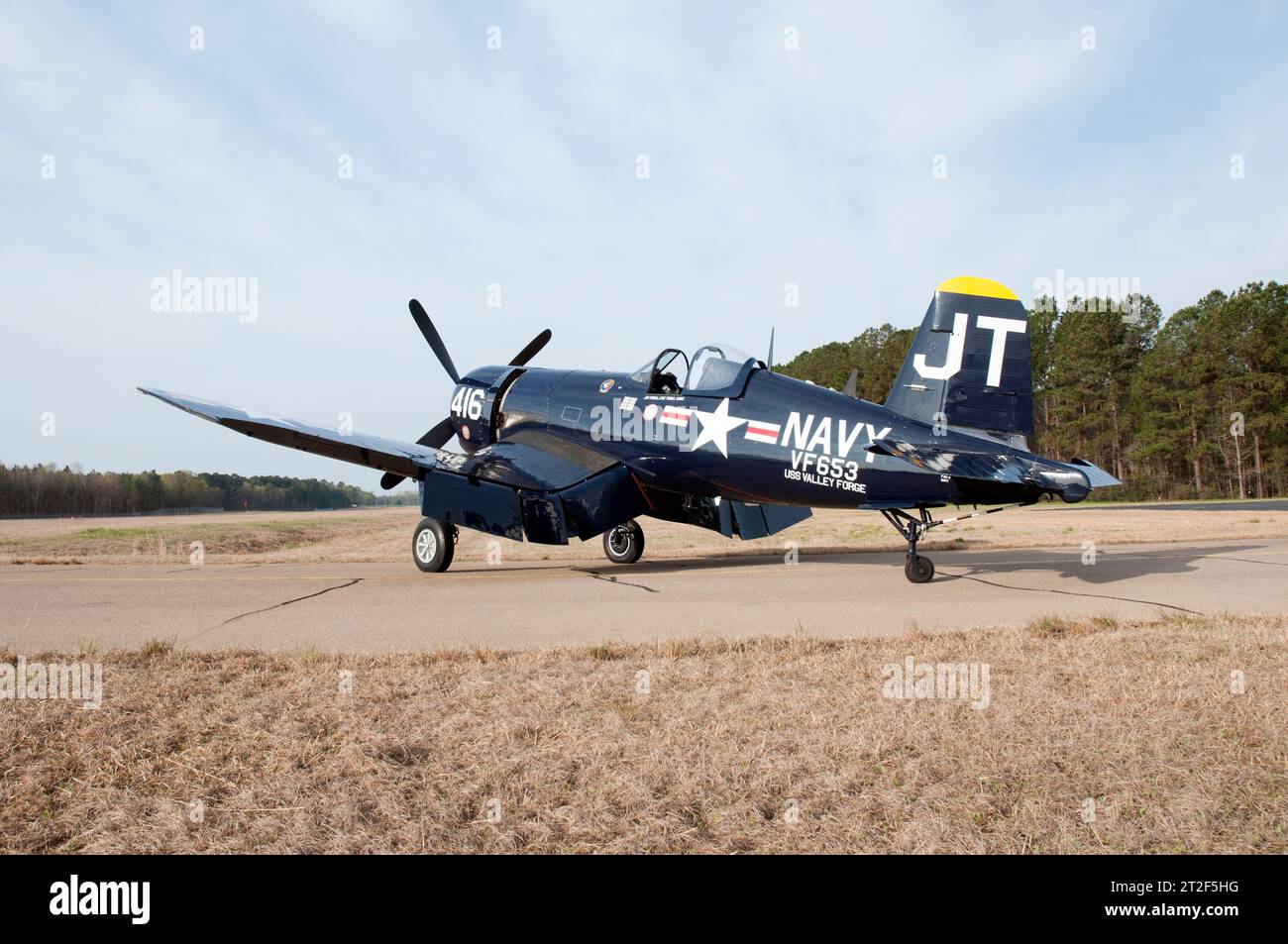 WWII and Korean War era F4U Corsair aircraft on an airfield Stock Photo ...