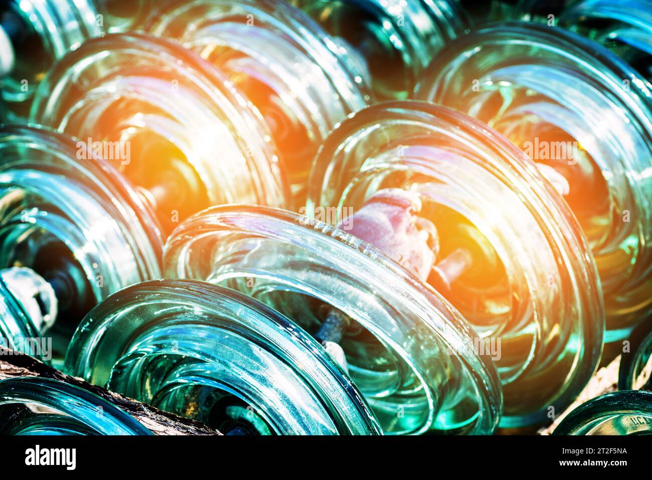 Glass transparent high-voltage insulator is in storage. Industrial ...