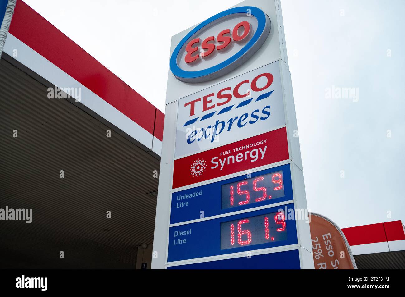 London- October 2, 2023: Esso fuel station and Tesco Express sign with ...