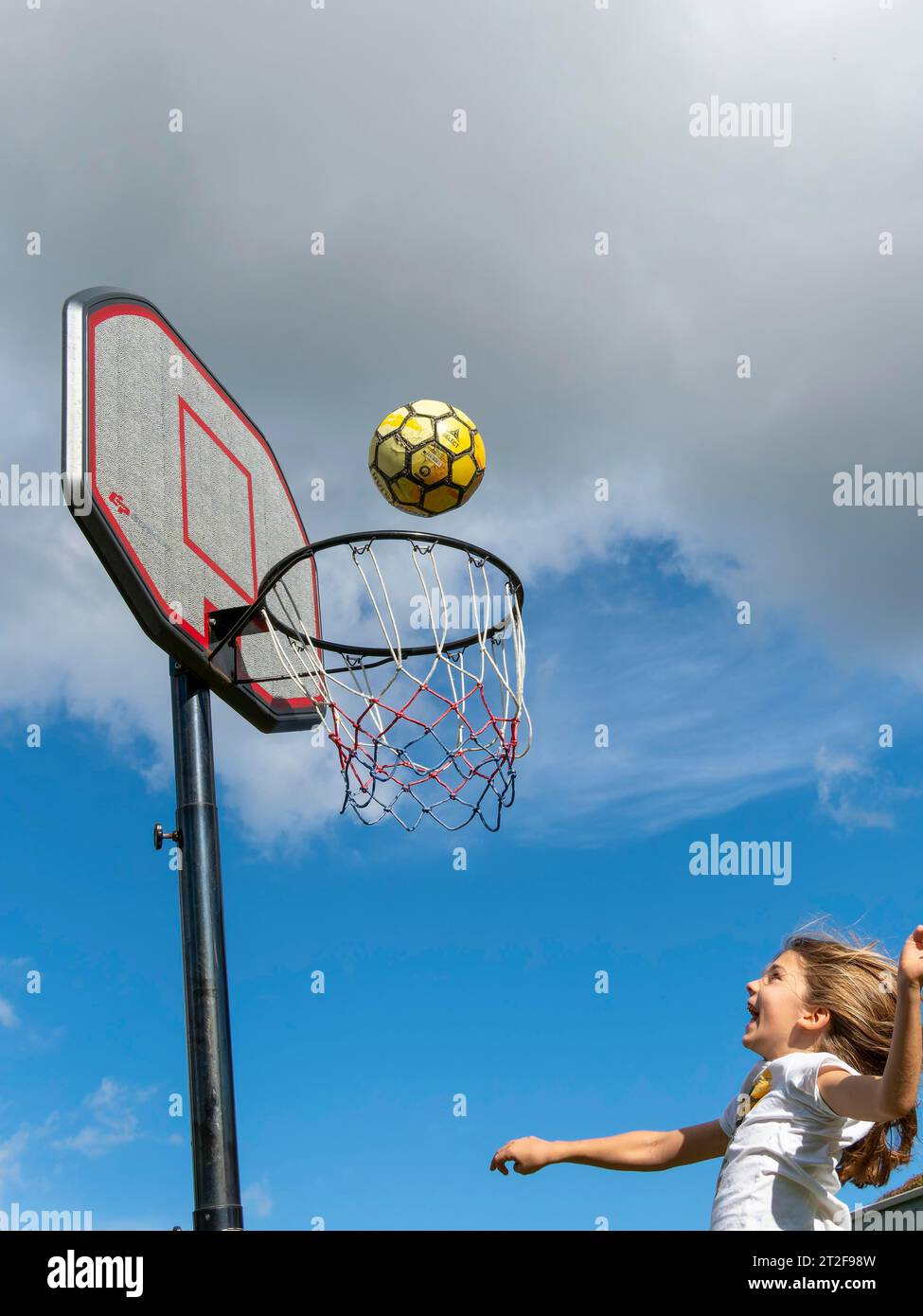 Basketball Jump with the ball to the basket and net, boy 10 years, sport activity with children ...