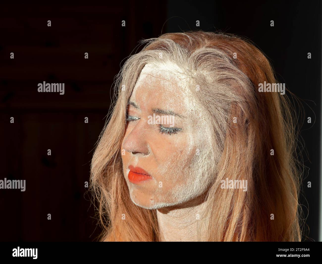 Woman with red lips, long hair, dusty face, drama, despair, suffering ...